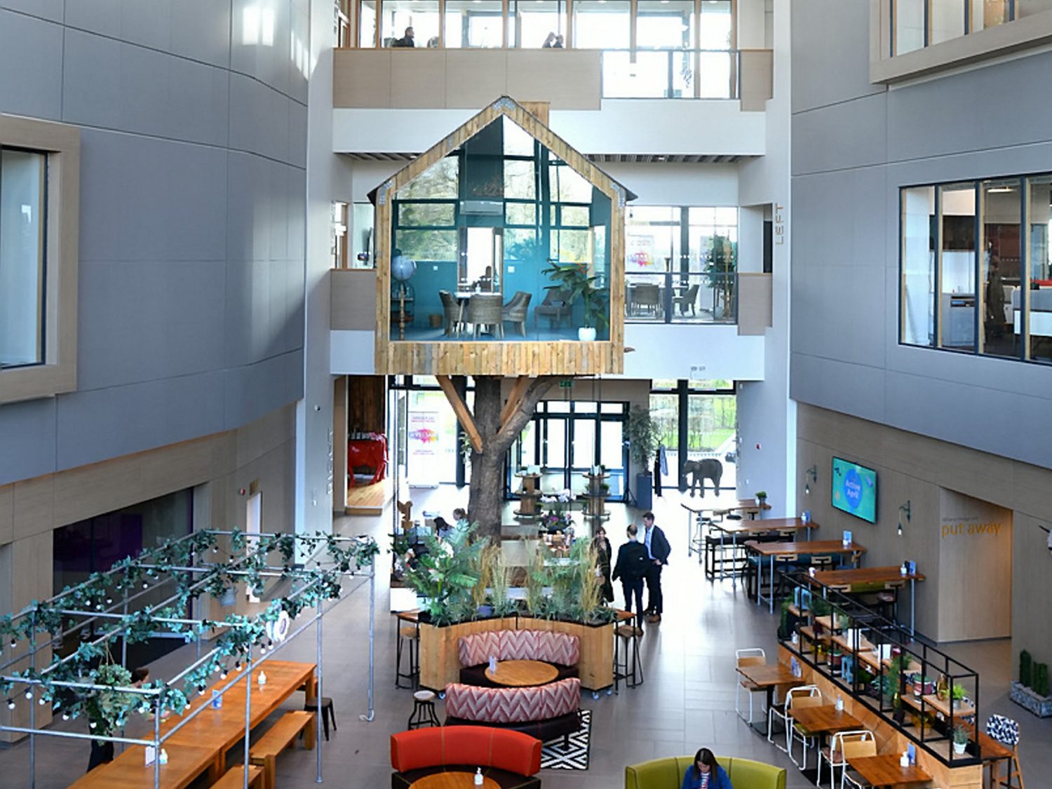 This office has a tree house for meetings, a zoo and even its own bar